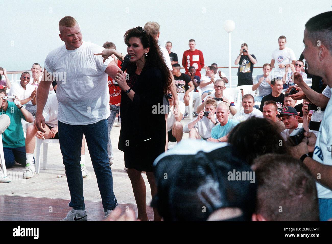 Entertainer Marie Osmond sings to a Marine on stage during a United ...