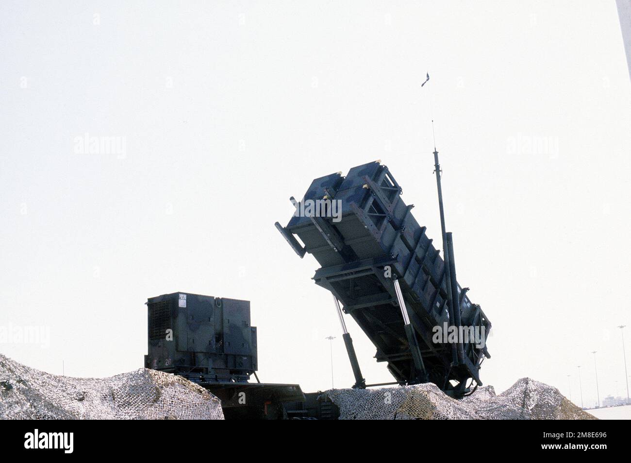 A partially camouflaged M-109 launching station for the MIM-104 Patriot ...