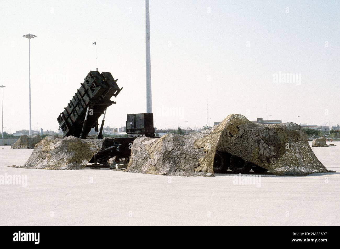 A partially camouflaged M-109 launching station for the MIM-104 Patriot ...