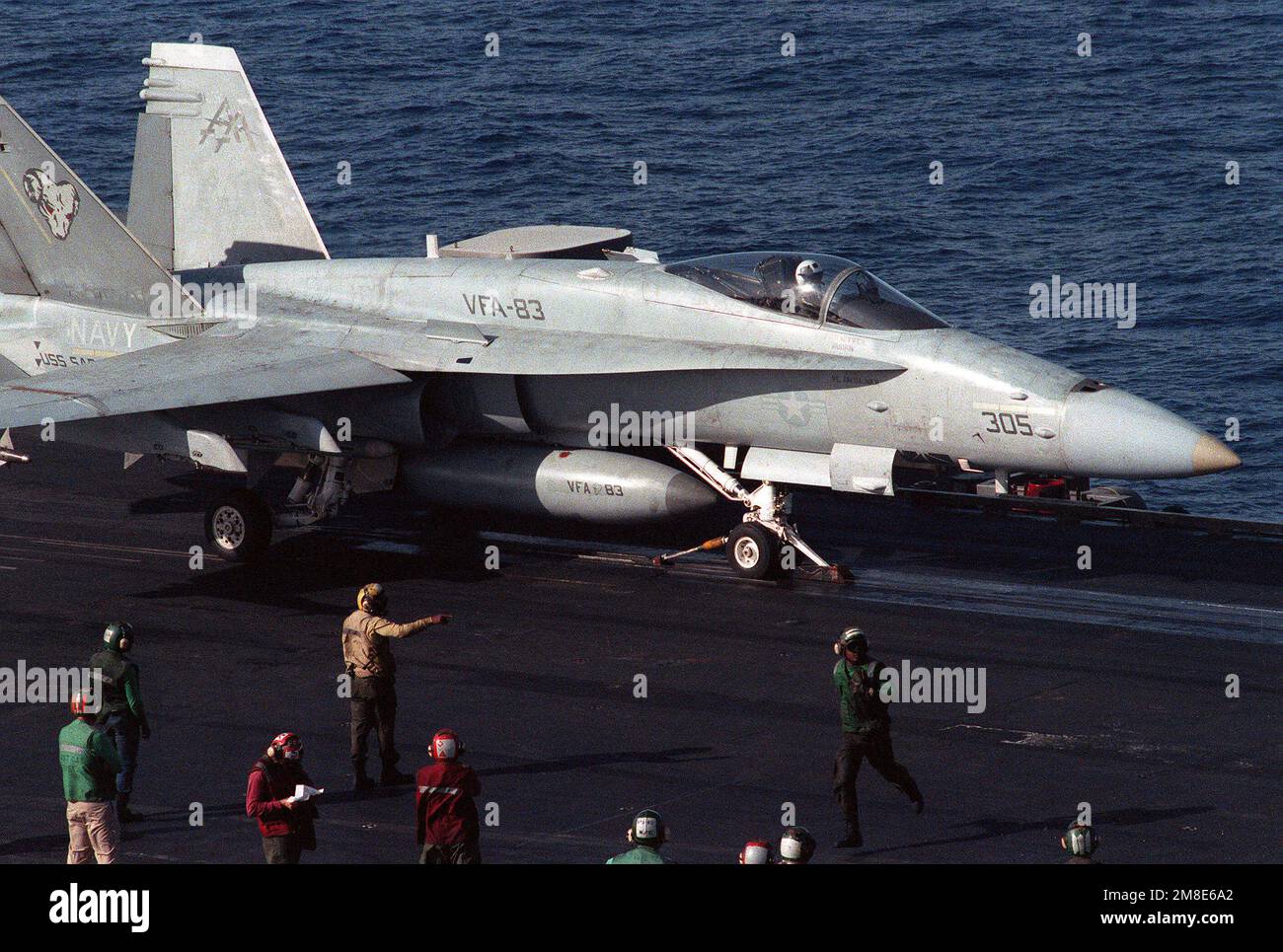 The pilot of a Strike Fighter Squadron 83 (VFA-83) F/A-18C Hornet ...