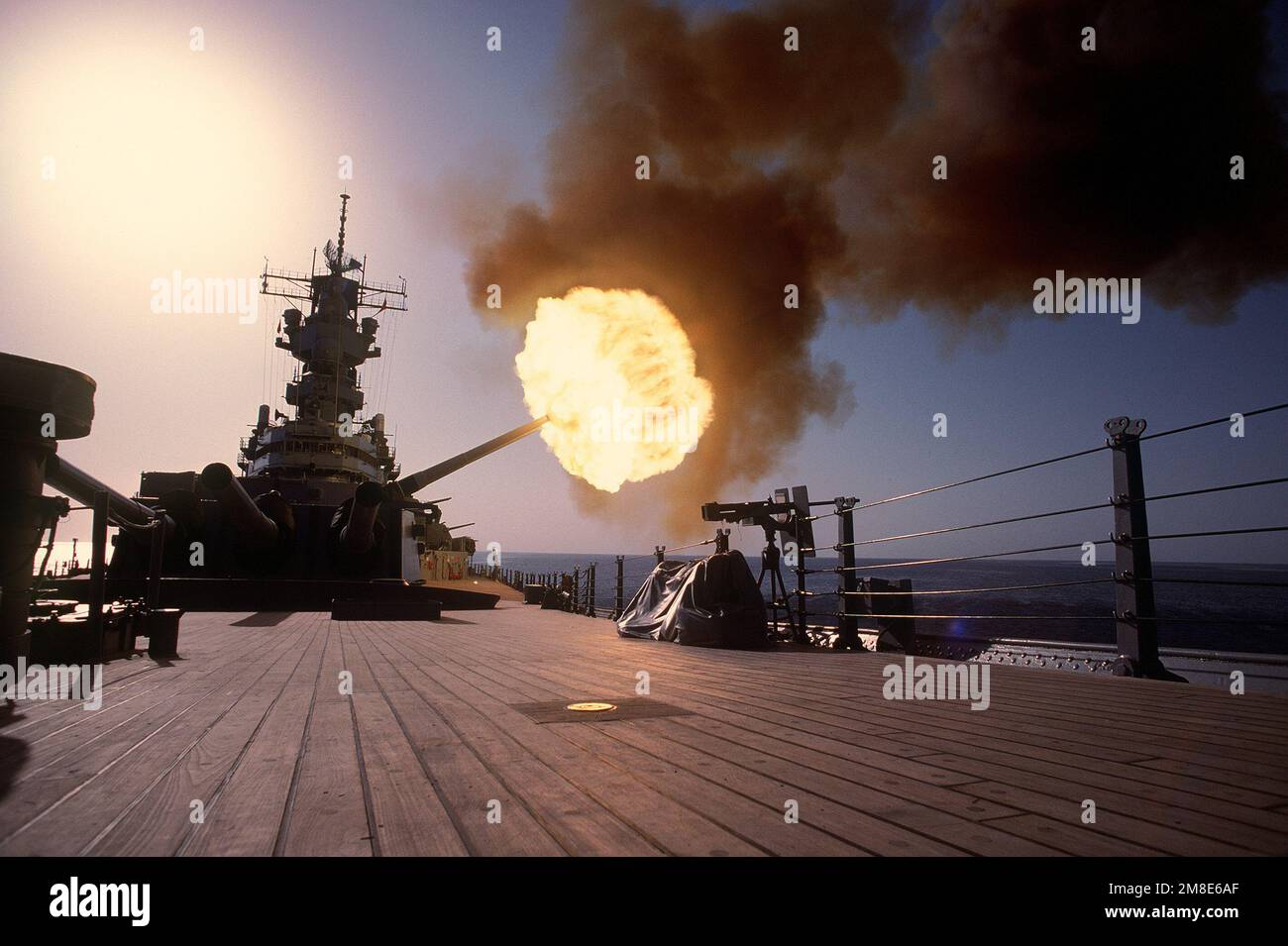 A projectile is fired off the port side from one of the Mark 7 16-inch ...