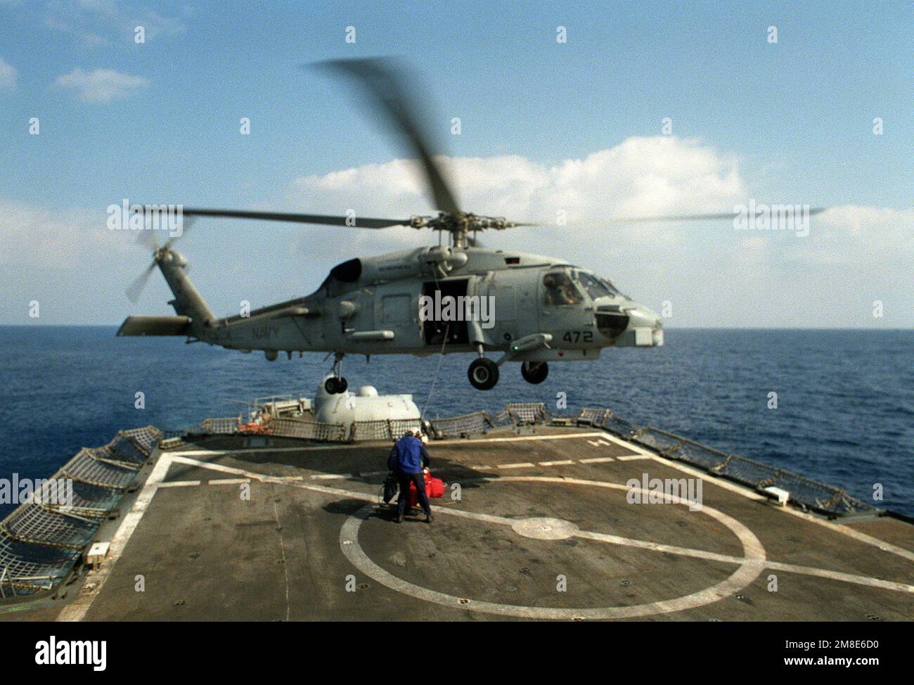 Flight decks crewmen aboard the guided missile cruiser USS BIDDLE (CG ...