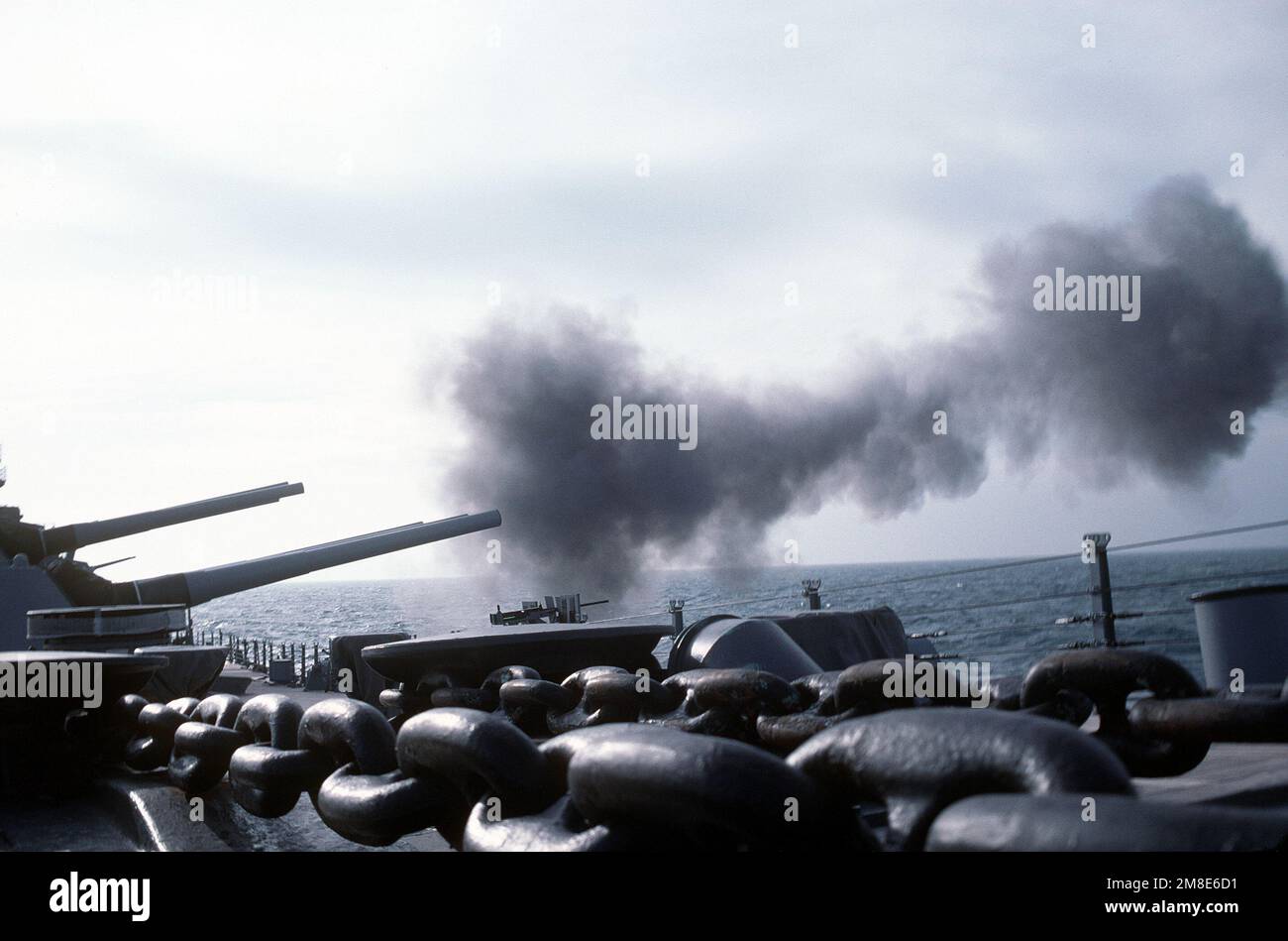 Smoke drifts away from the battleship USS WISCONSIN (BB-64) after the ...