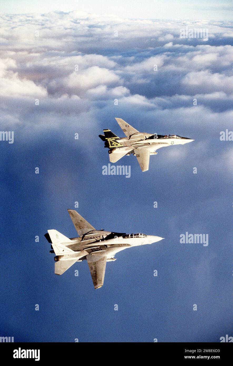 An air-to-air right side view of a Fighter Squadron 32 (VF-32) F-14A ...