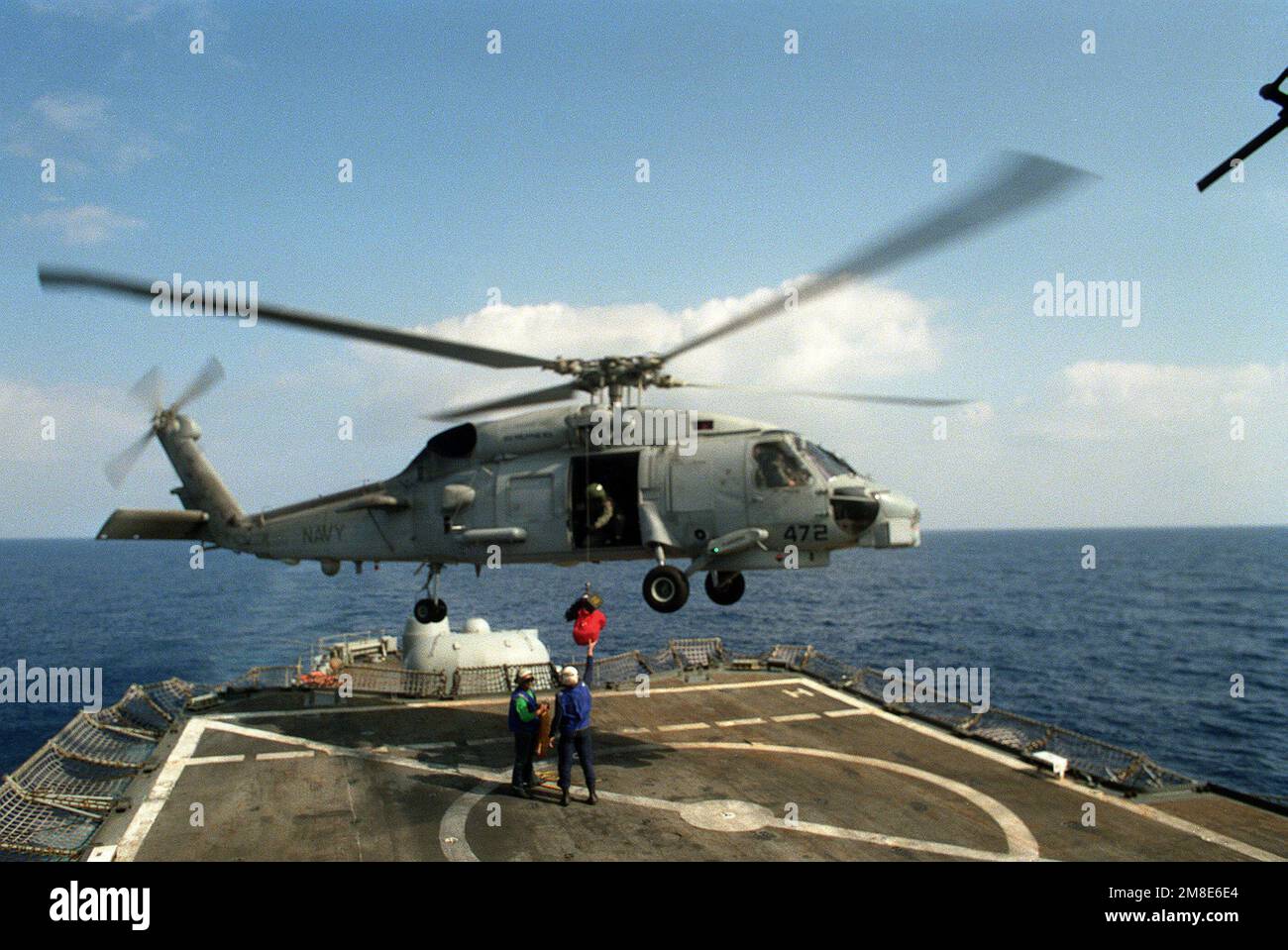 A flight deck crewmen aboard the guided missile cruiser USS BIDDLE (CG ...