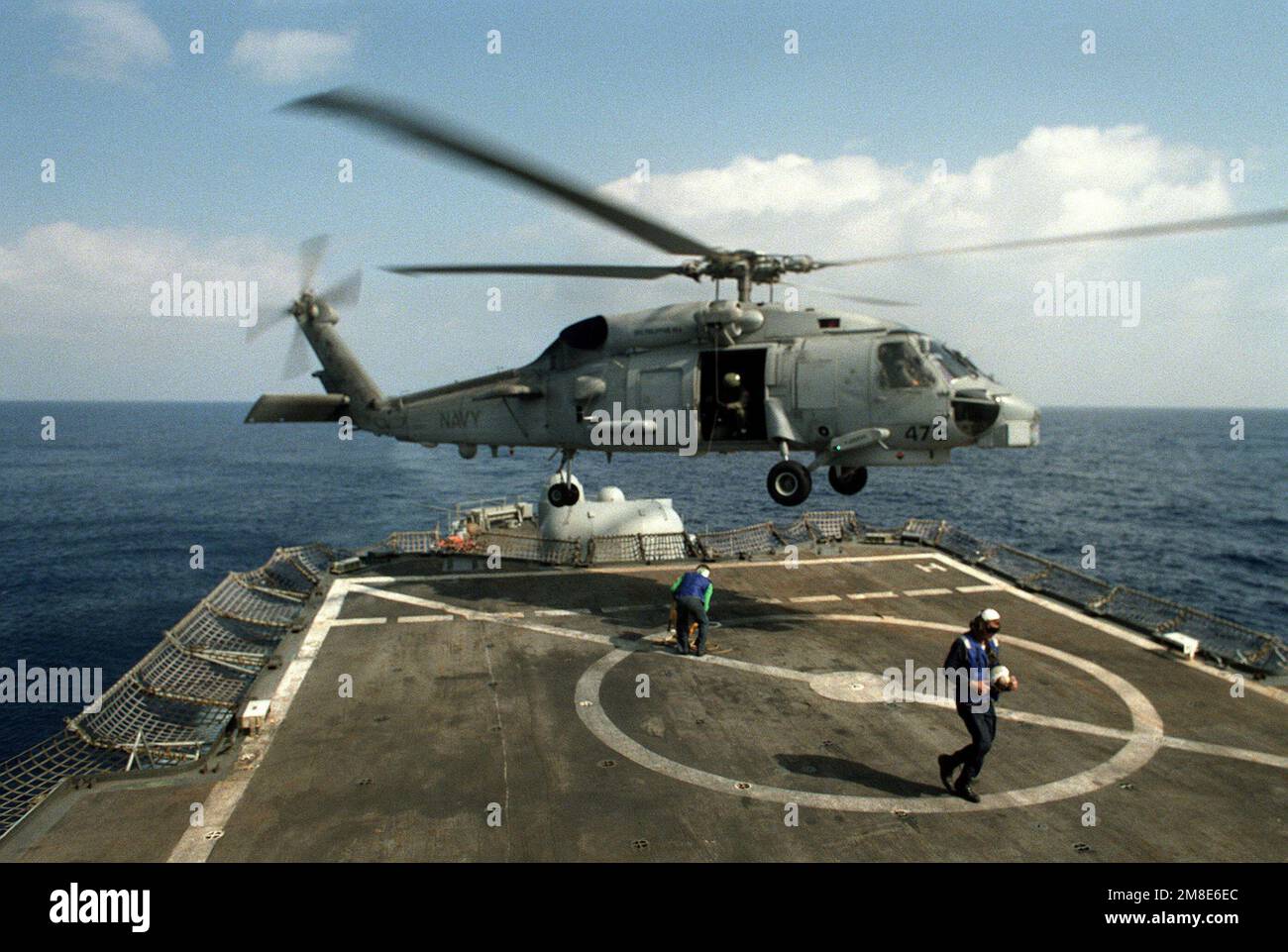 A flight crewman aboard the guided missile cruiser USS BIDDLE (CG-34 ...