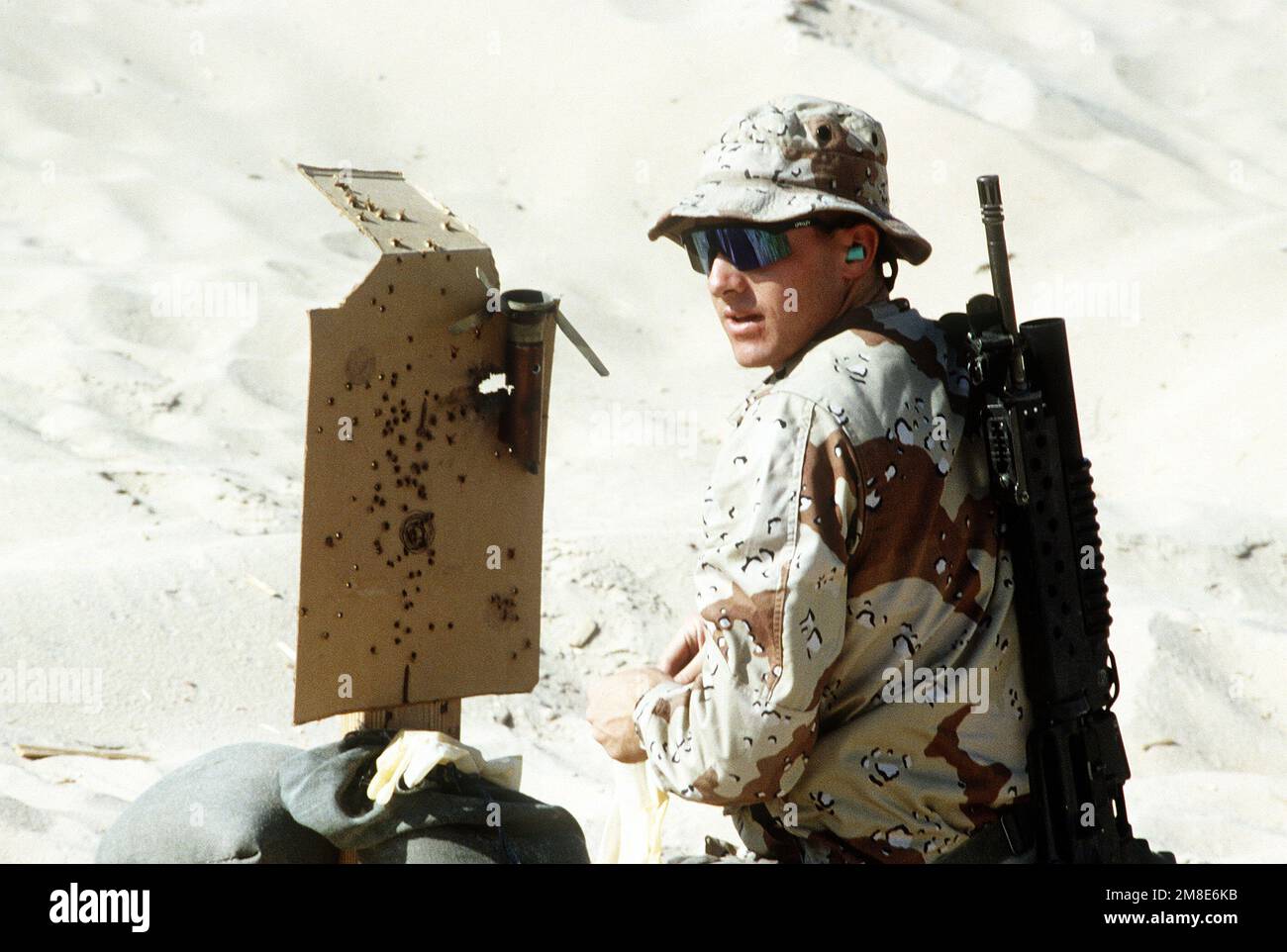 A Marine from 7th Platoon, 1ST Force Reconnaissance Company, checks his ...