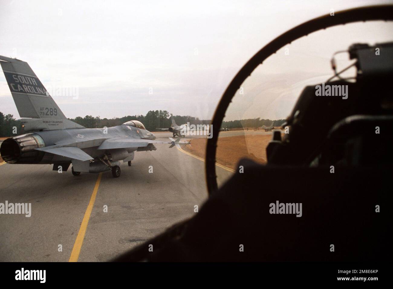 As seen from the cockpit of another aircraft, two F-16A Fighting Falcon ...