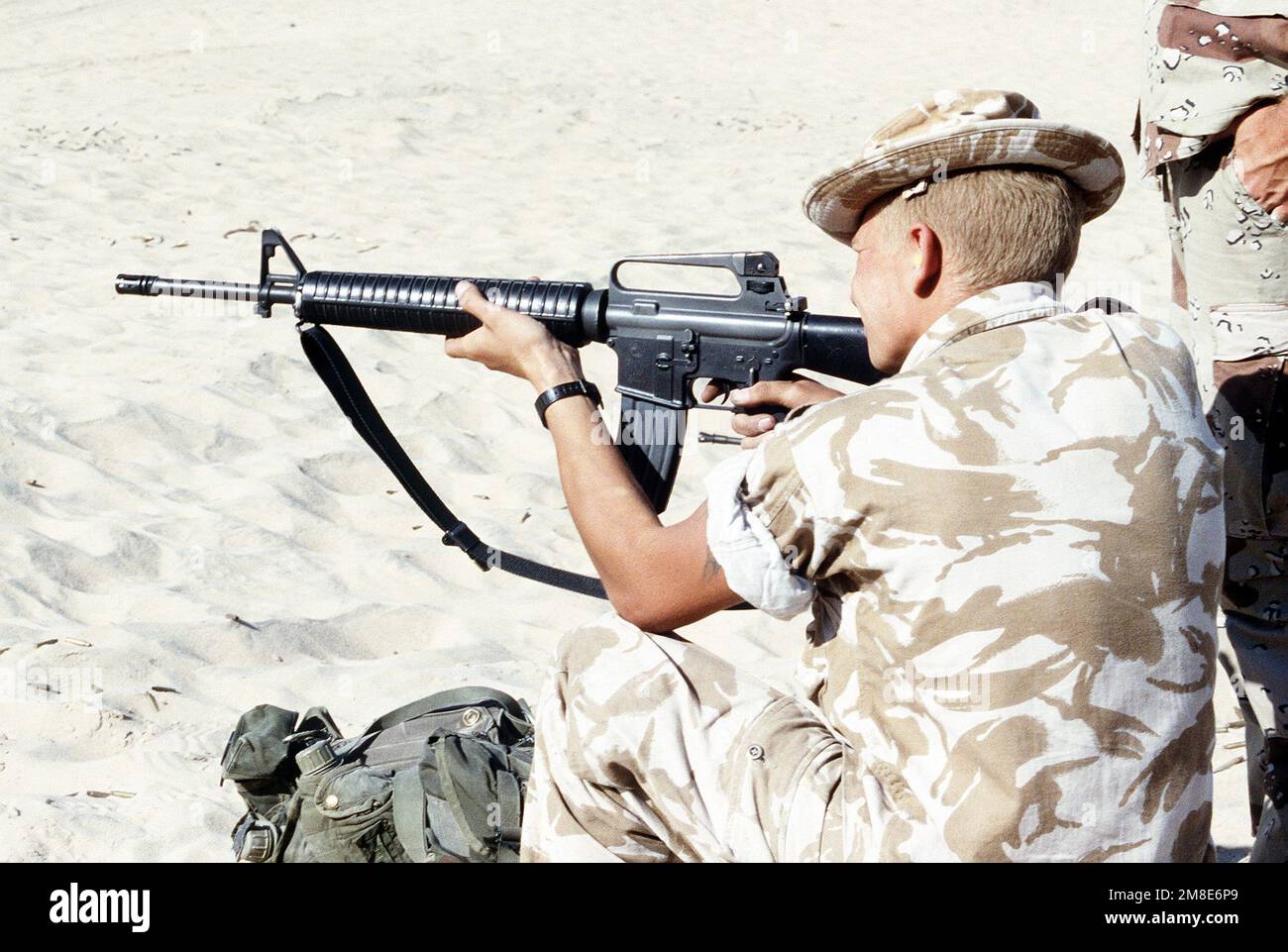 A Marine from 7th Platoon, 1ST Force Reconnaissance Company, fires his ...