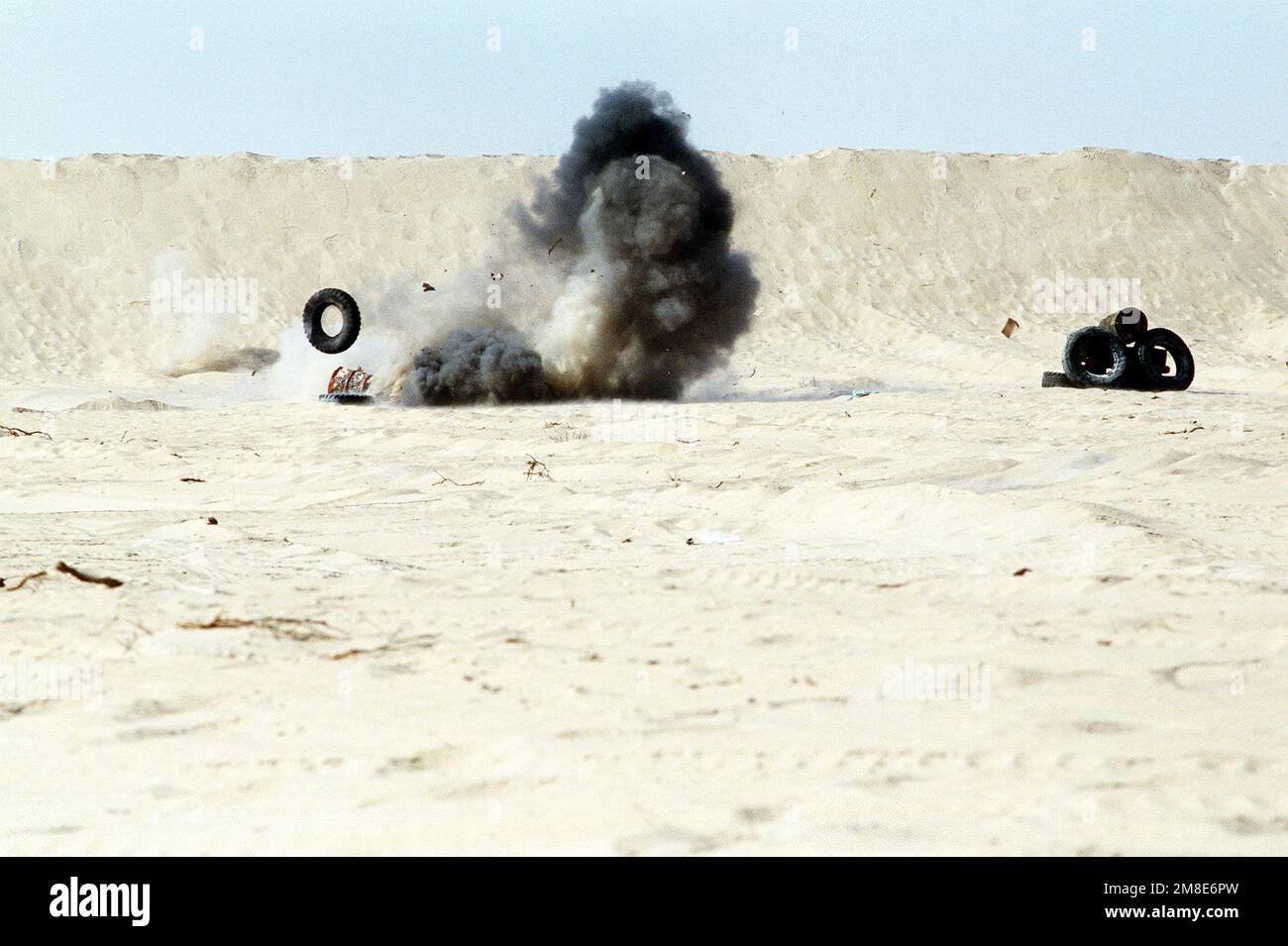 A round from an M-72 light anti-tank weapon (LAW) destroys a target at ...