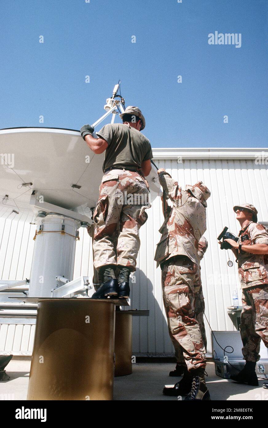 TECH. SGT. Evans videotapes SGT. Holemyer, left and MASTER SGT. DeLeon ...