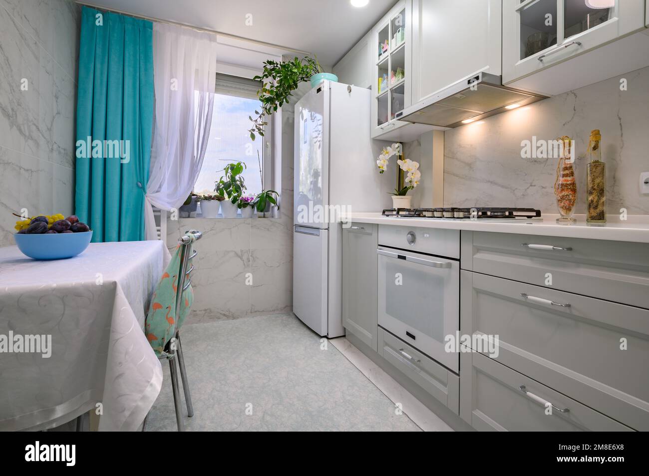 New light grey modern well designed kitchen interior Stock Photo - Alamy