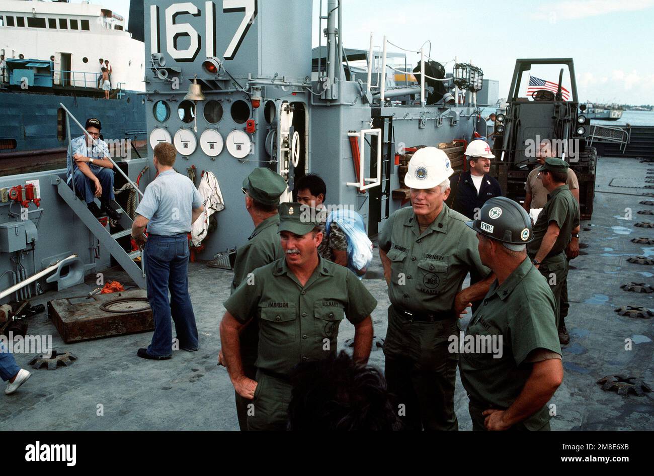 US Navy Seabees stand aboard utility landing craft LCU 1617, docked in ...