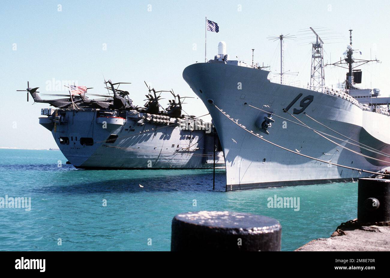 Marine CH-53E Super Stallion helicopters line the stern of the ...