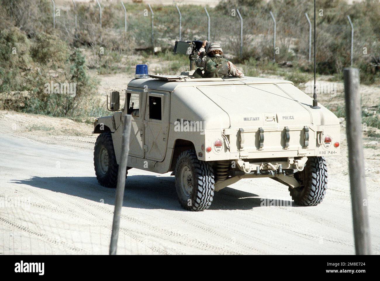 SPEC. Tracy Burgett, 810th Military Police Company, mans a 7.62mm M60 ...