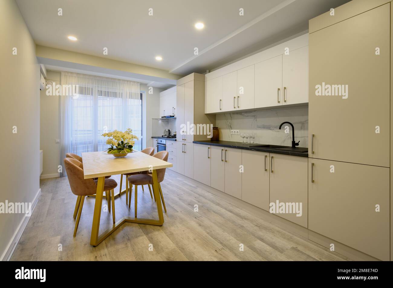 Large beige and cream luxury kitchen interior Stock Photo - Alamy