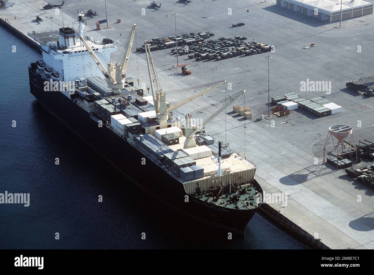 The vehicle cargo ship 2nd LT. JOHN P. BOBO (T-AK-3008) offloads cargo ...