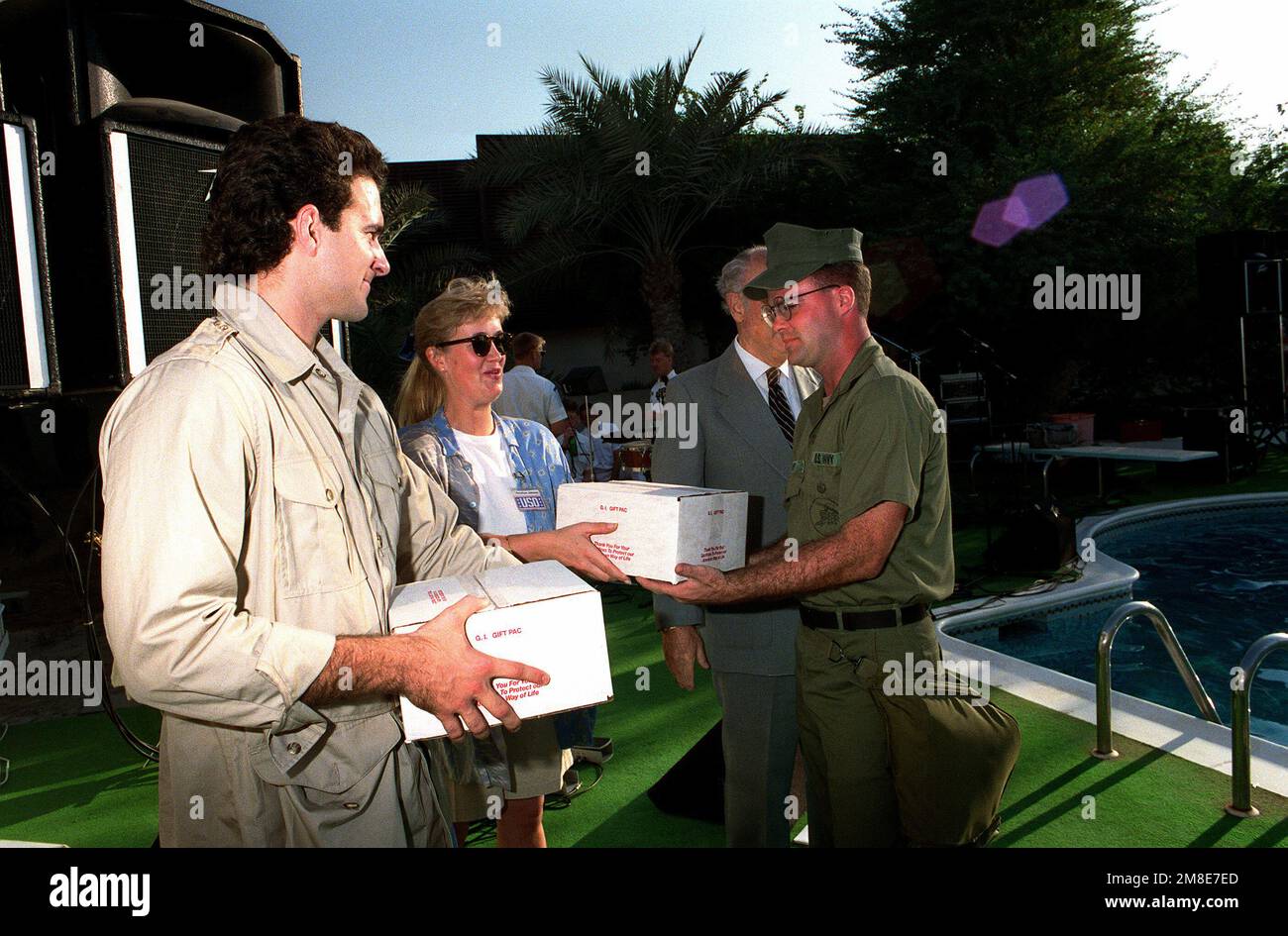 Volunteers from the United Service Organizations (USO) distribute gift ...