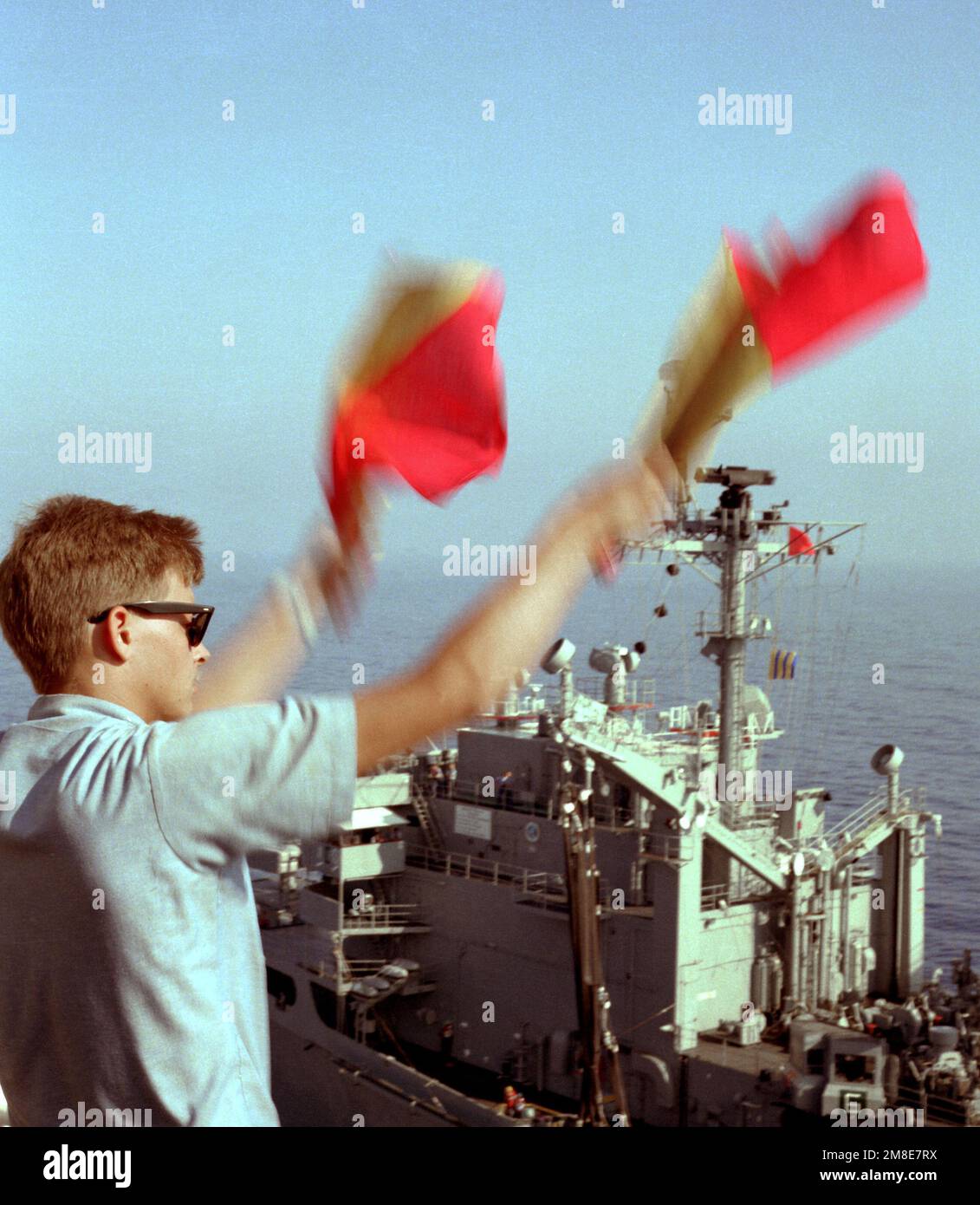 During an underway replenishment, Signalman 3rd Class Christopher ...