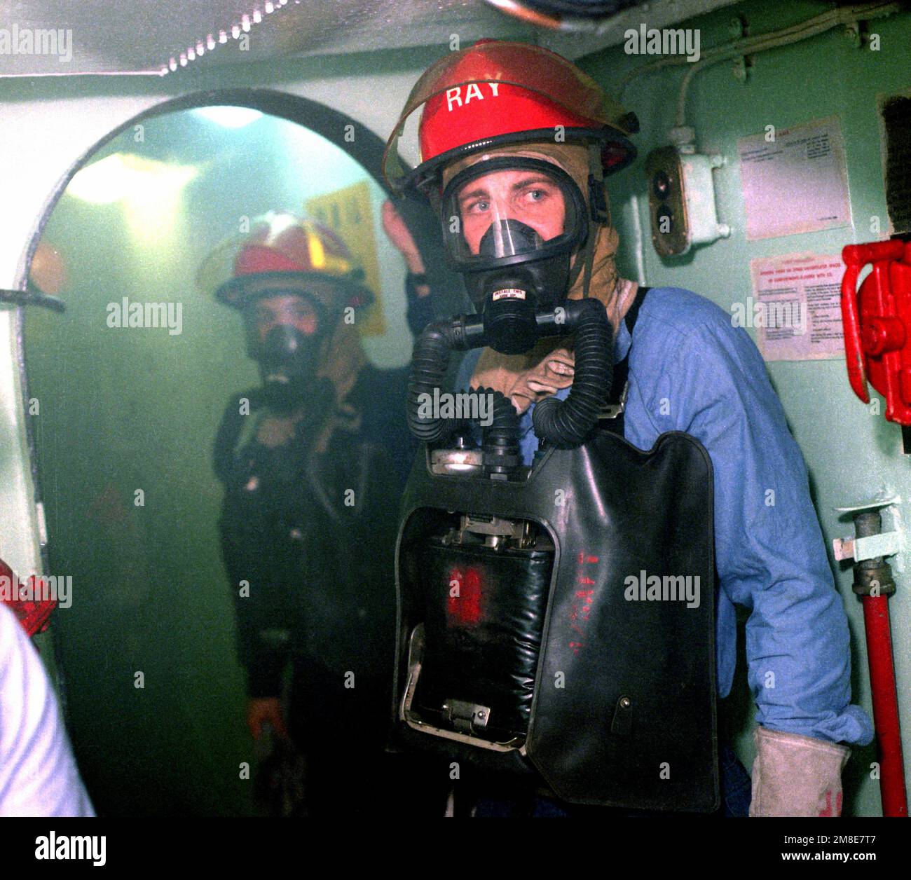 Intelligence SPECIALIST SEAMAN Willis Ray wears an oxygen breathing ...