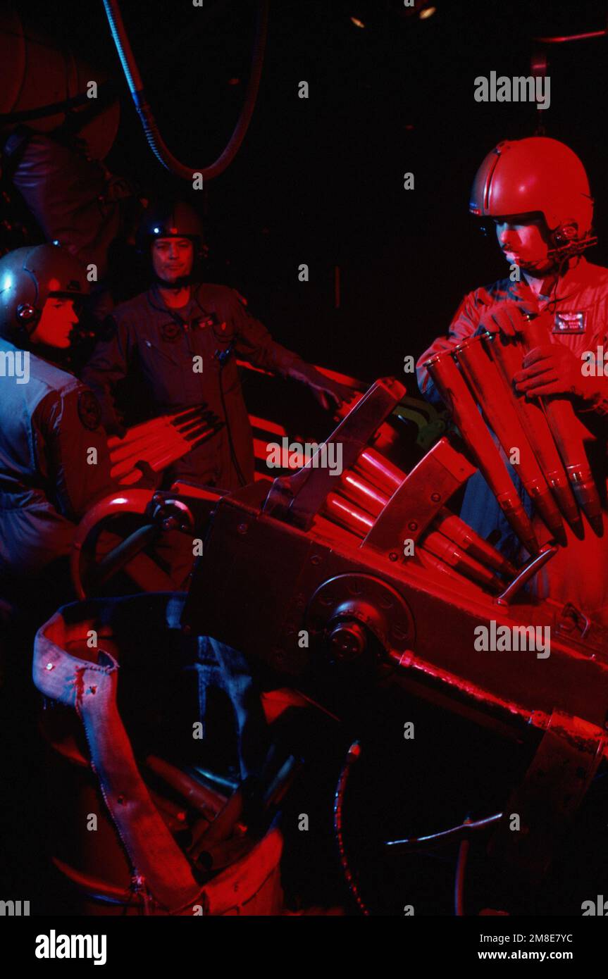 SSGT Bobby Daniels, right, prepares to load a clip of ammunition into a ...