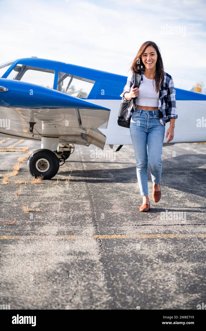 Young BIPOC Female Pilot doing preflight check on small plane Stock ...