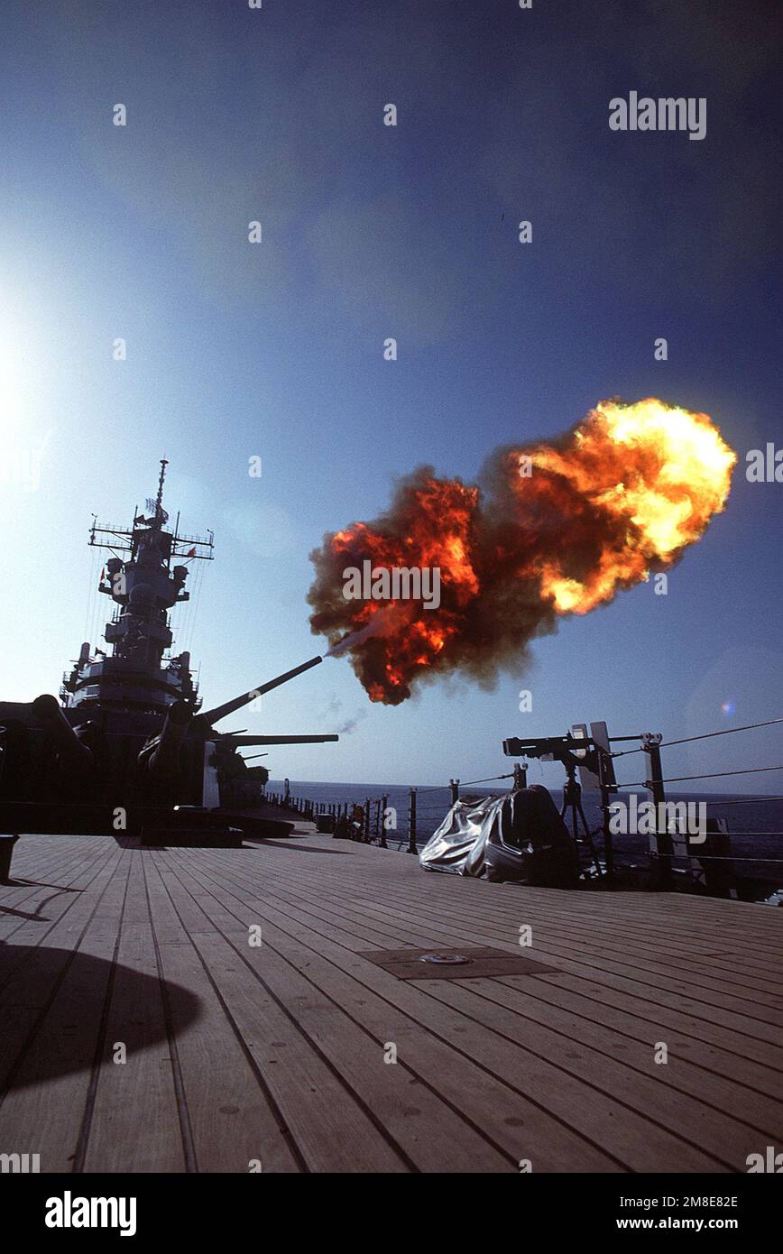 A projectile is fired from a Mark 7 16-inch/50-caliber gun in the No. 2 ...