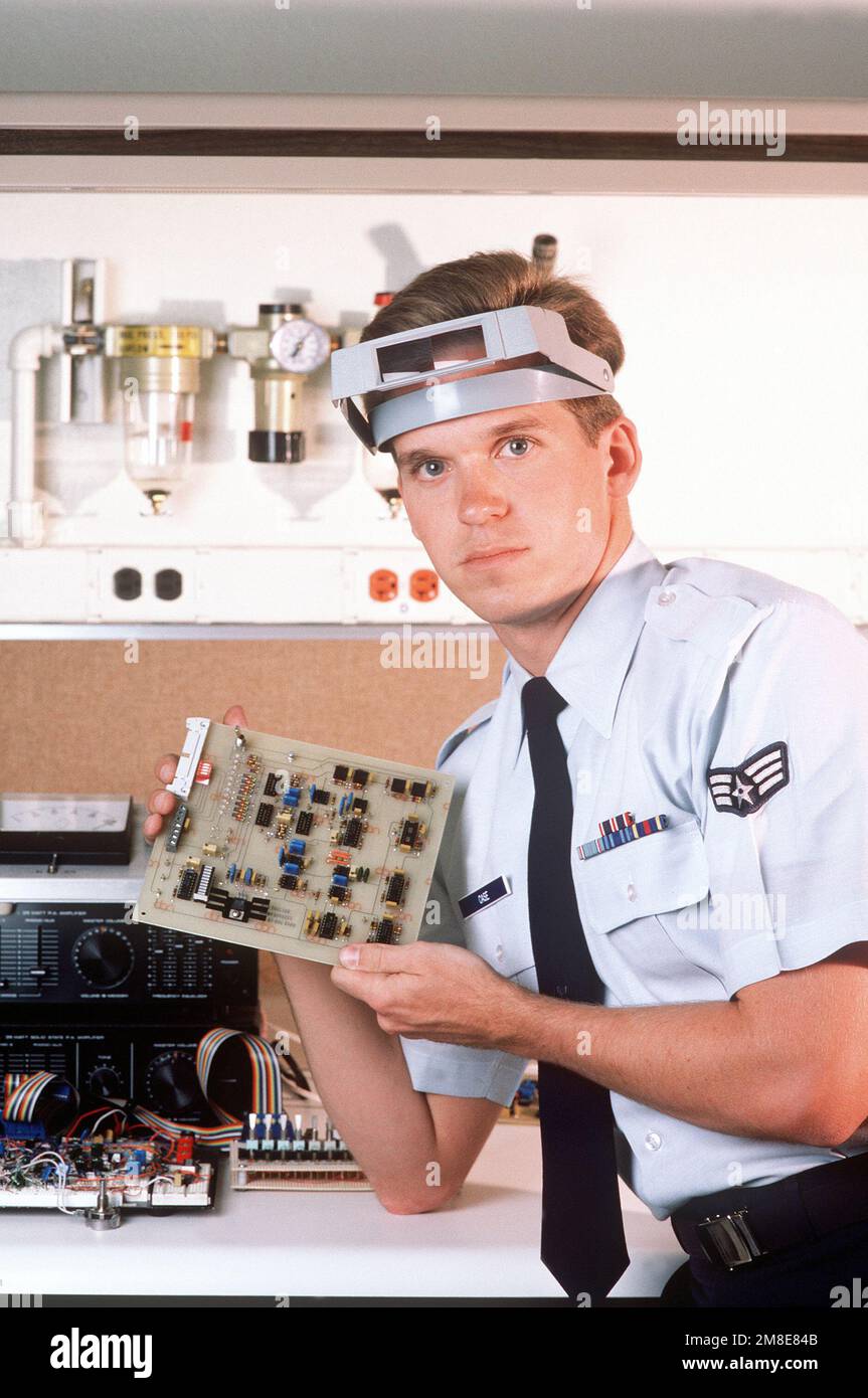 SGT James Case displays a circuit board from a computer-driven sound ...