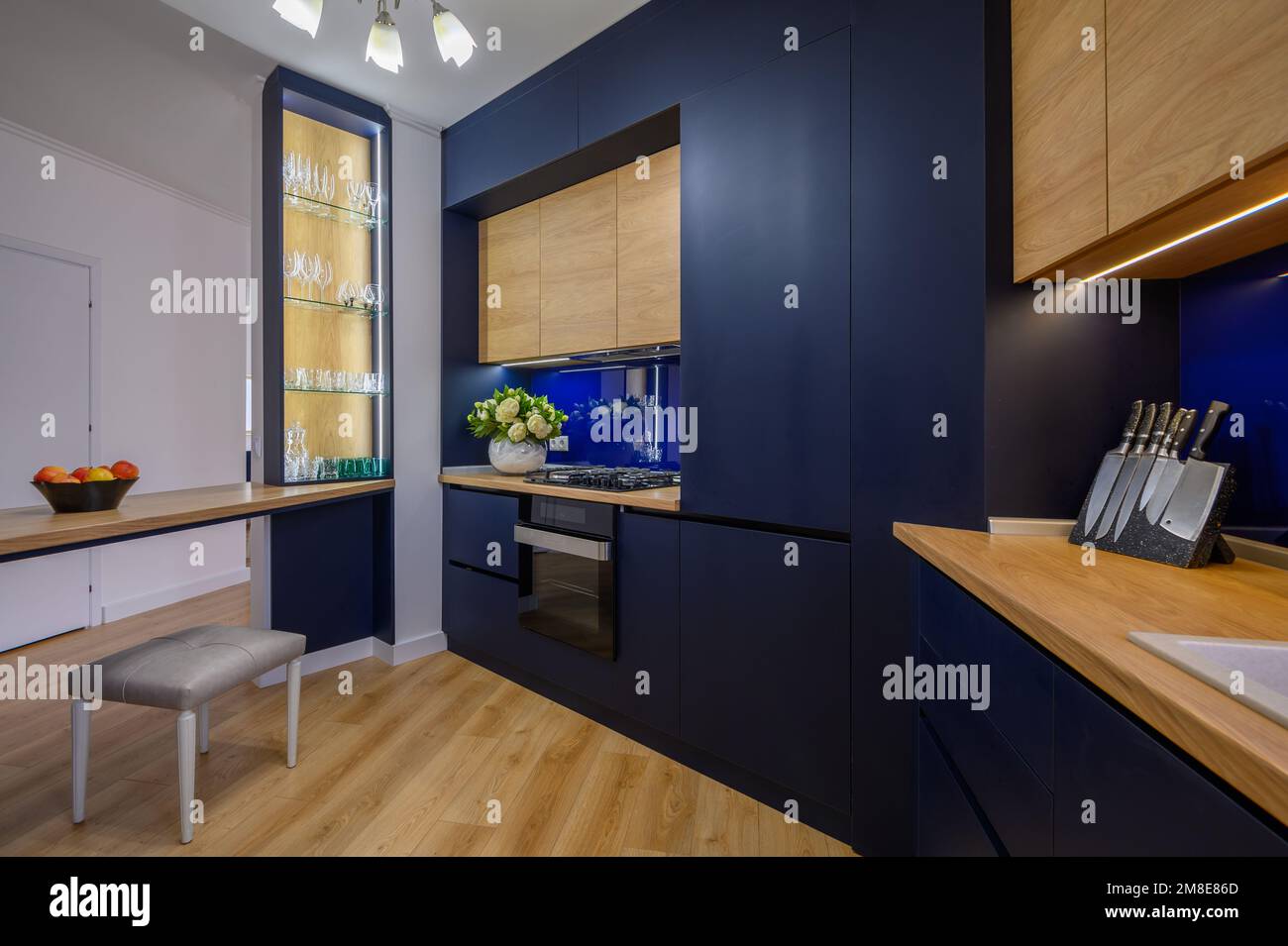 Stylish blue colored studio studio apartment with kitchen open to ...
