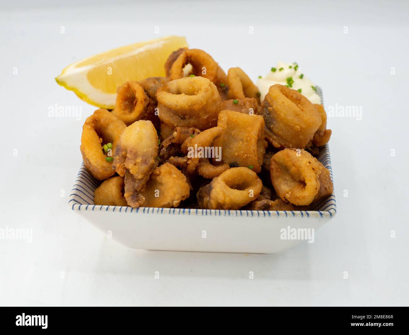 Ration of typical Spanish fried calamari rings Stock Photo - Alamy