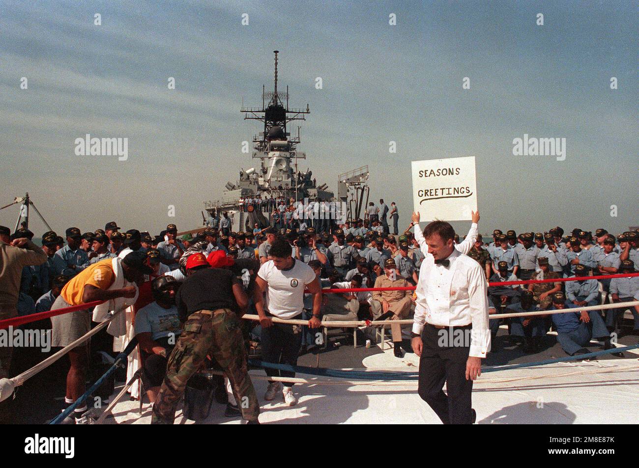 A boxer is tended to in his corner between rounds during a boxing match ...