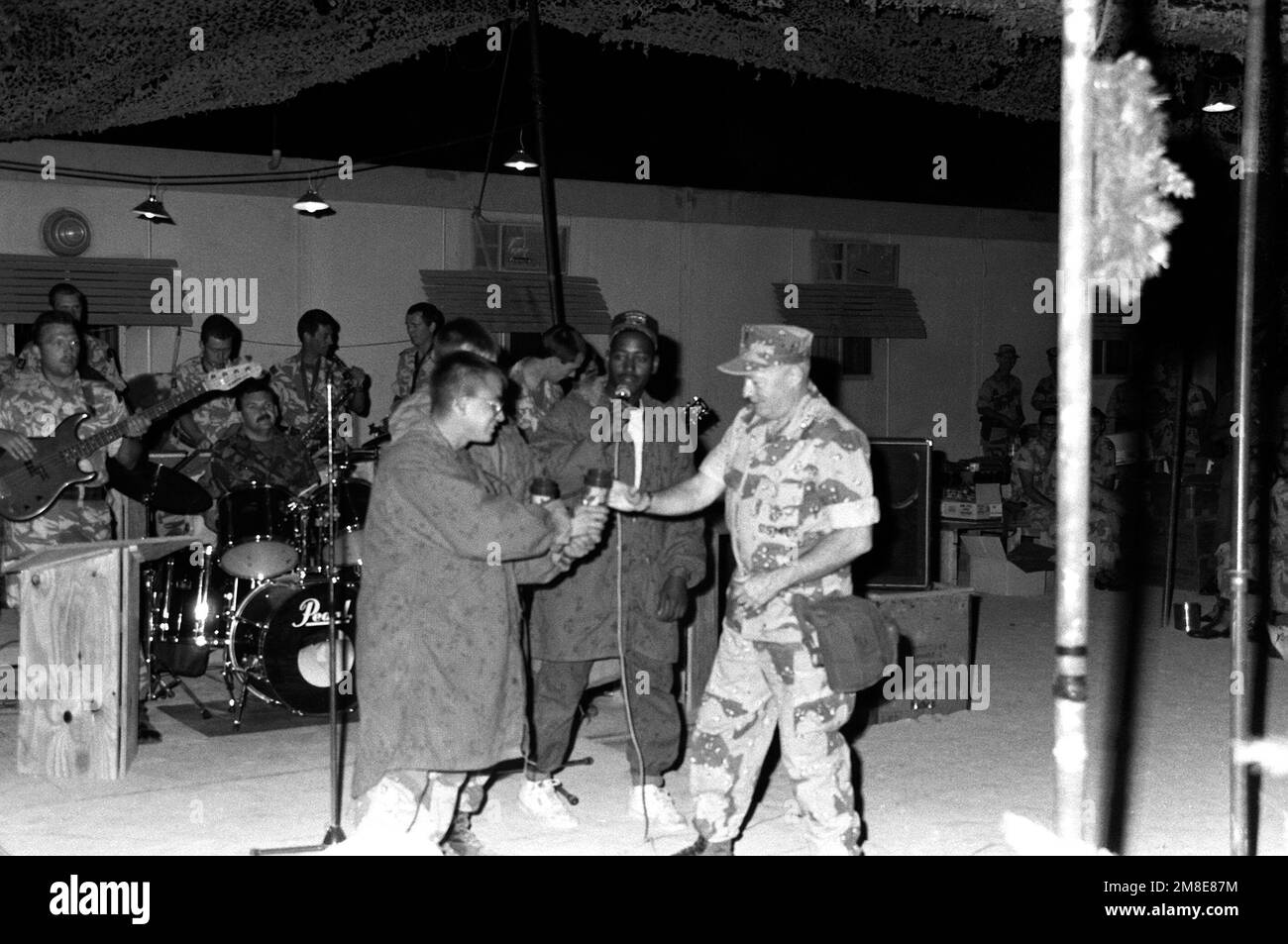 GEN Alfred M. Gray, commandant of the Marine Corps, accepts a gift from ...