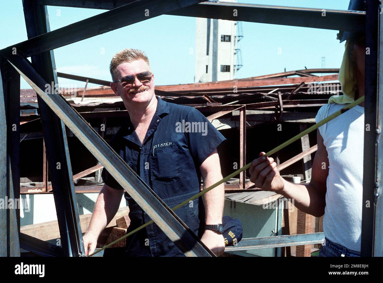A crew member from the amphibious transport dock USS DULUTH (LPD 6 ...