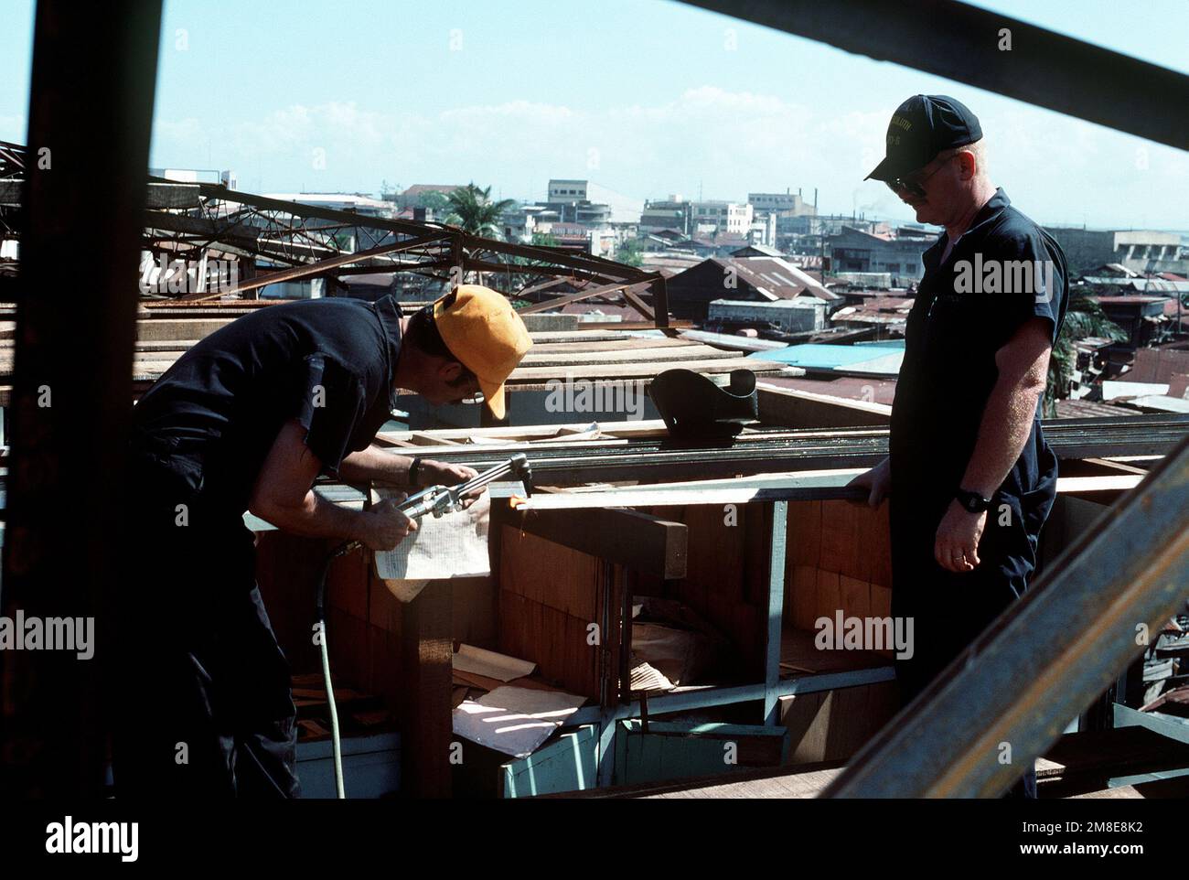 A crew member from the amphibious transport dock USS DULUTH (LPD 6 ...
