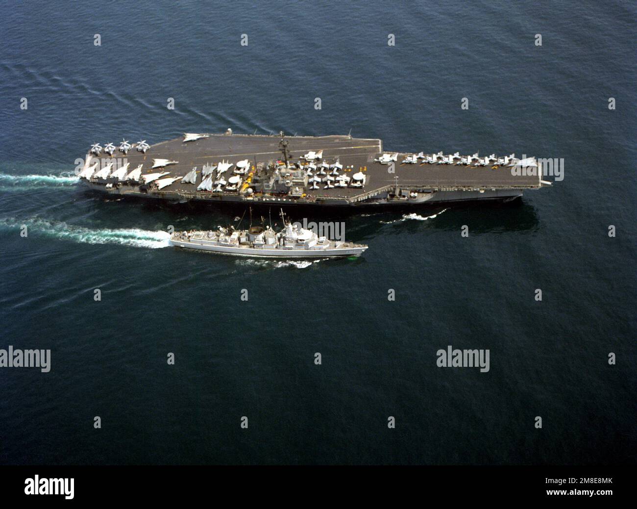 An overhead view of the aircraft carrier USS RANGER (CV-61) conducting ...