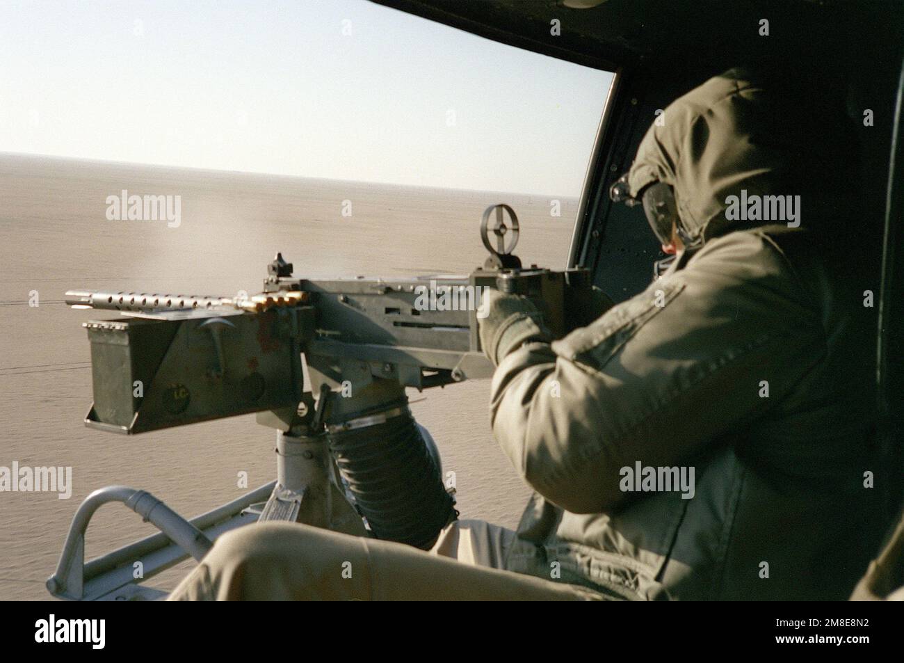 A member of Marine Light Helicopter Squadron 767 (HML-767) fires a .50 ...