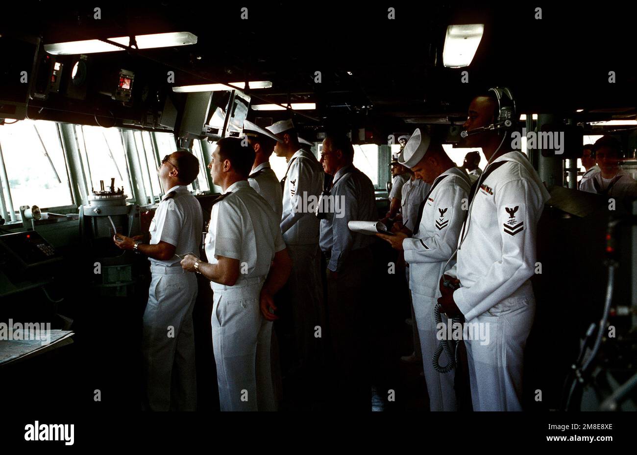 CMDR John G. Morgan Jr., left, commanding officer of the guided missile ...