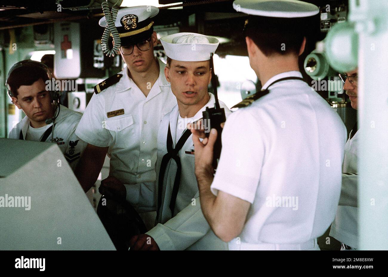 The helmsman confirms a course change on the bridge of the guided ...