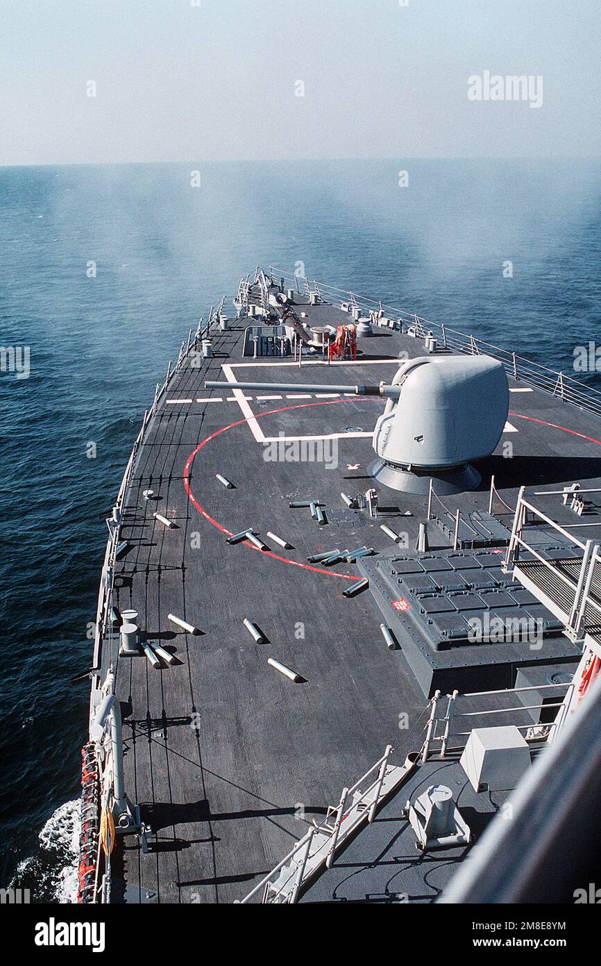 The 5-inch/54-caliber gun near the bow of the guided missile destroyer ...