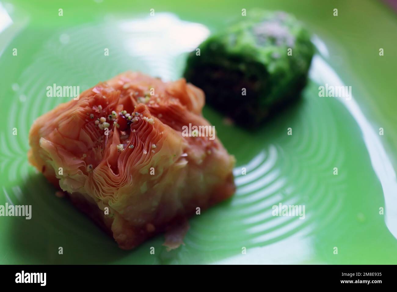 Sweet Turkish delight on a green flat plate Stock Photo - Alamy