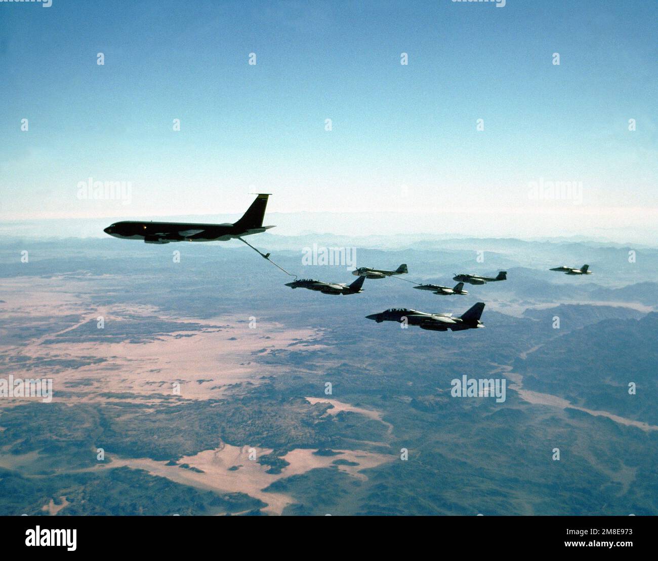 A Fighter Squadron 33 (VF-33) F-14A Tomcat aircraft is refueled by an ...