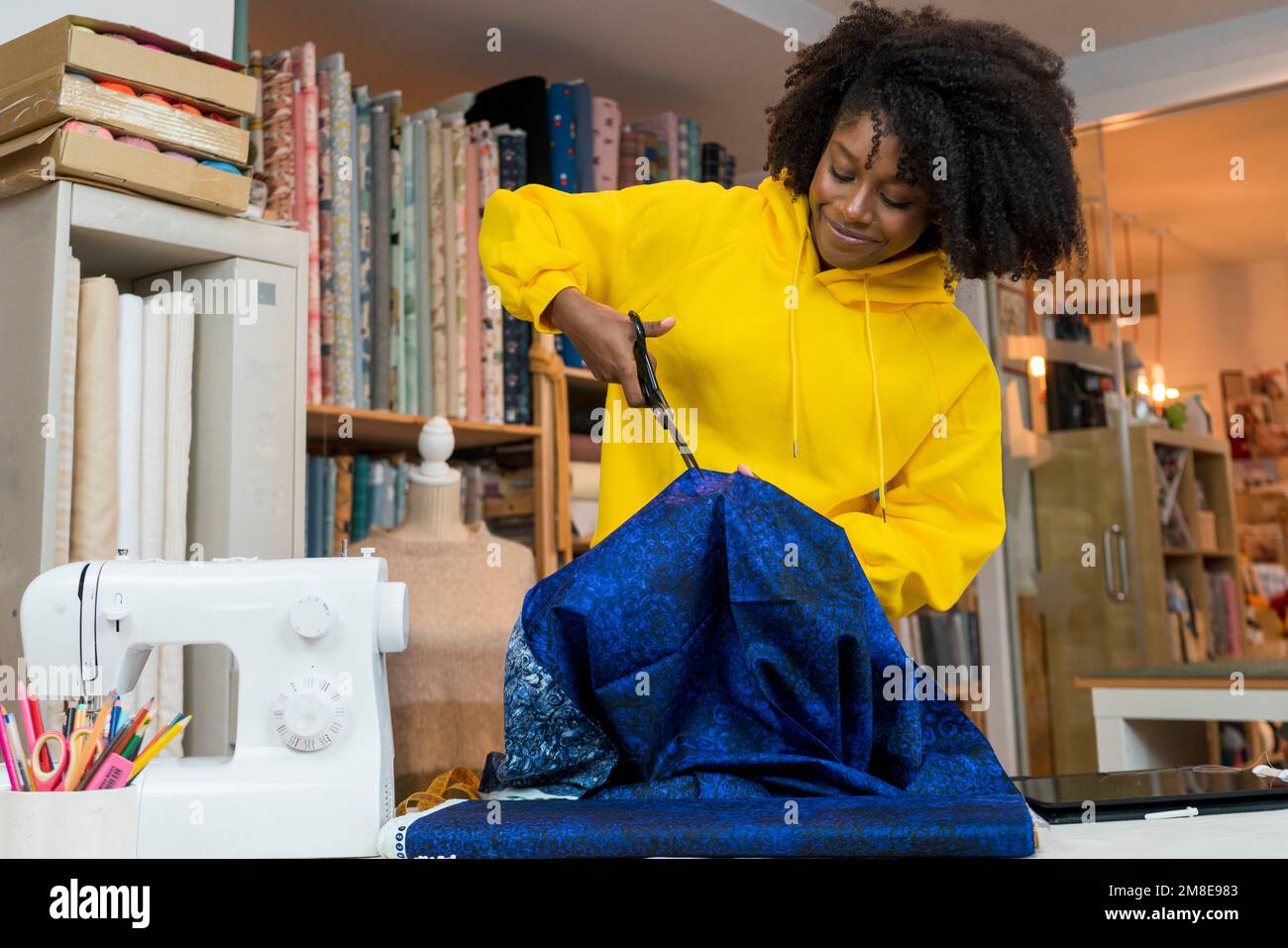 African american girl in her sewing workshop Stock Photo - Alamy