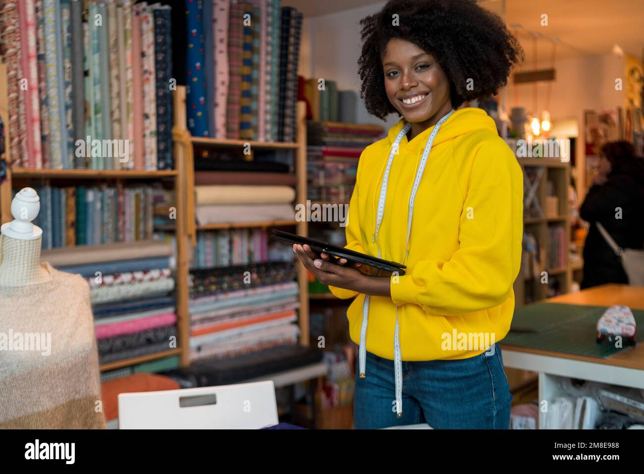 African american girl in her sewing workshop Stock Photo - Alamy