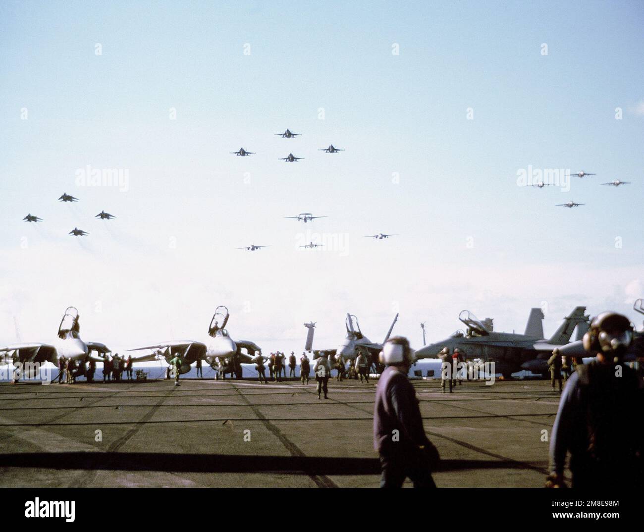 Sixteen aircraft from Carrier Air Wing 1 (CVW-1) fly in fromation over ...