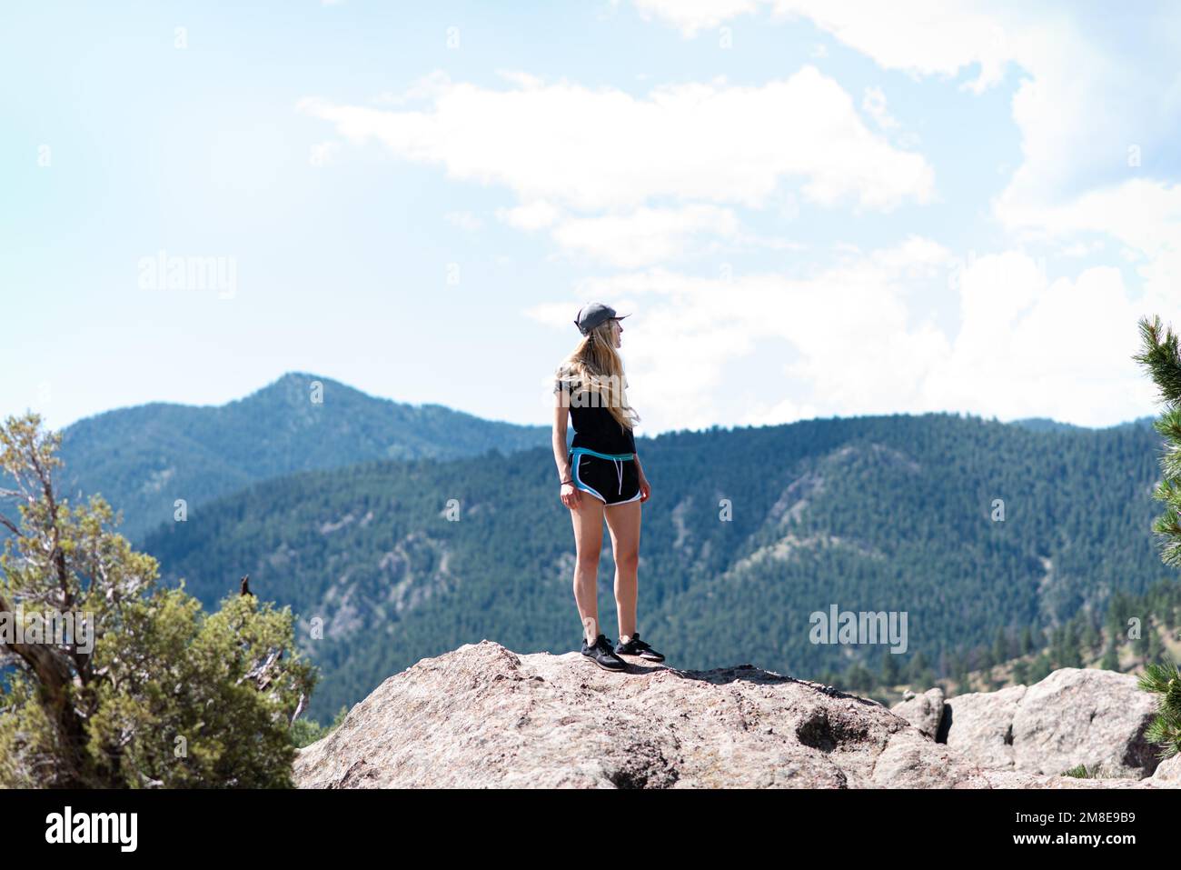 Young Woman Looking on Mountaintop While Hiking in Boulder Colorado ...