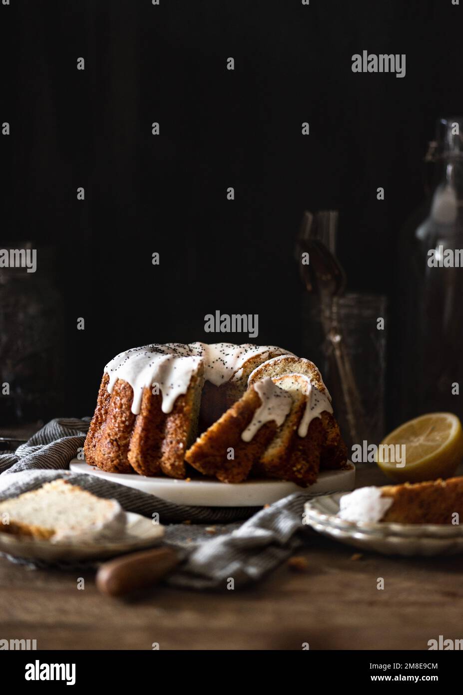 Slice lemon poppy seed cake table scape Stock Photo - Alamy