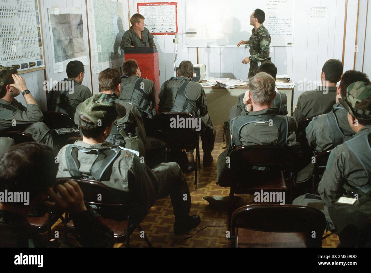 Squadron Commander LT. COL. Bruce Wright, at podium, brief members of ...