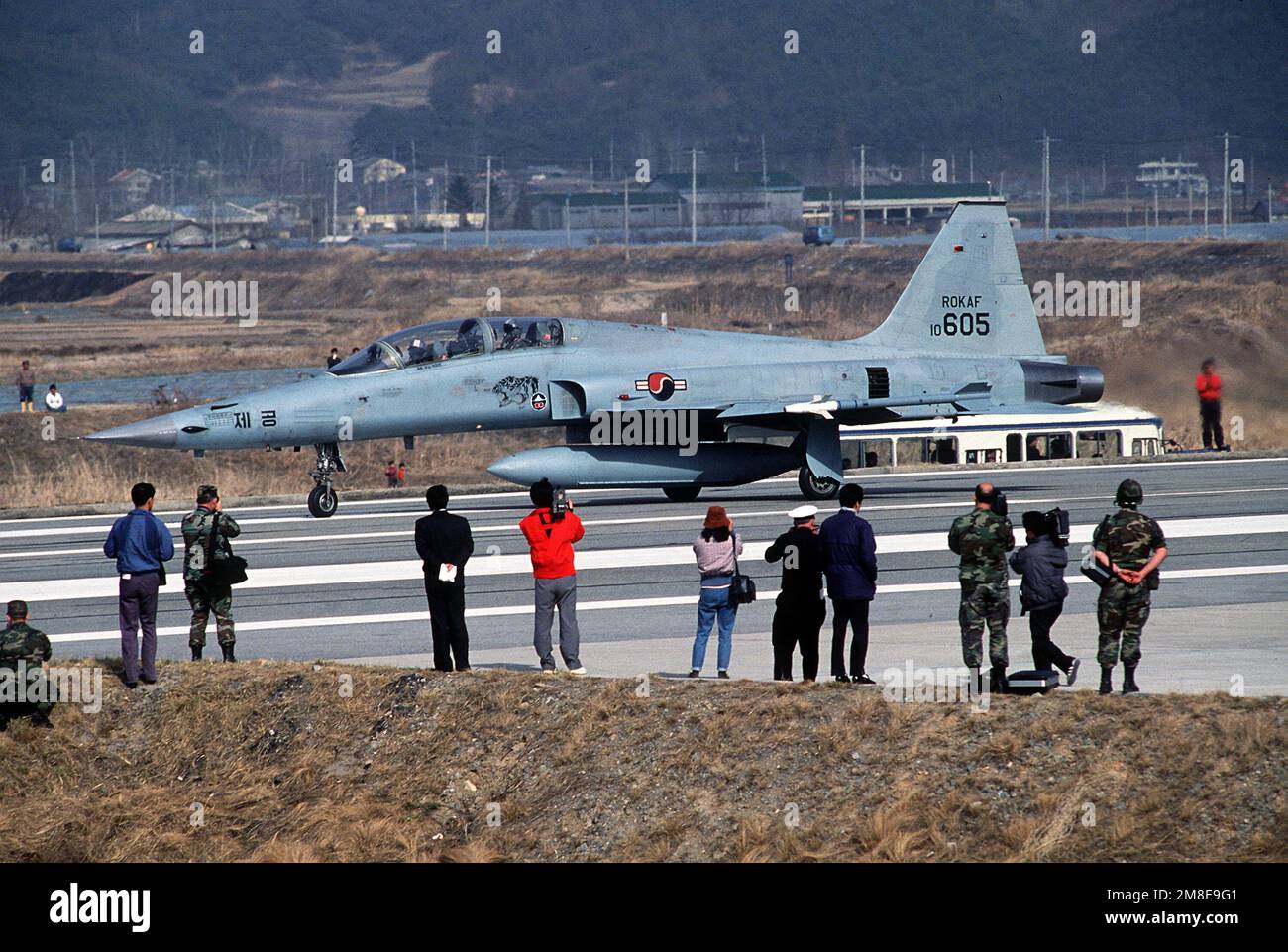 Spectators watch as a Republic of Korea Air Force (ROKAF) F-5F Tiger II aircraft taxis past at a ...