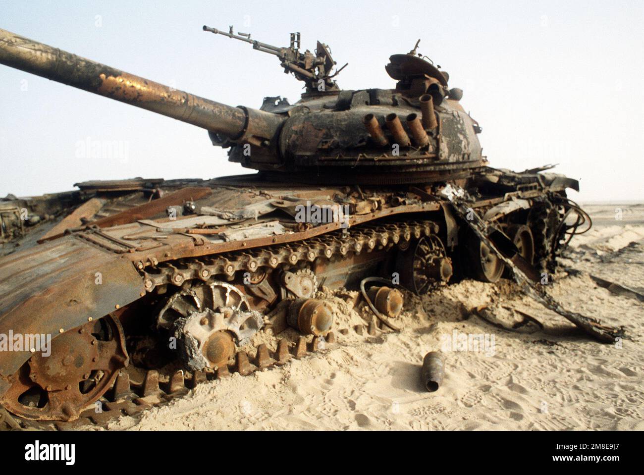 A destroyed Iraqi T-72 main battle tank sits in the desert in the wake ...
