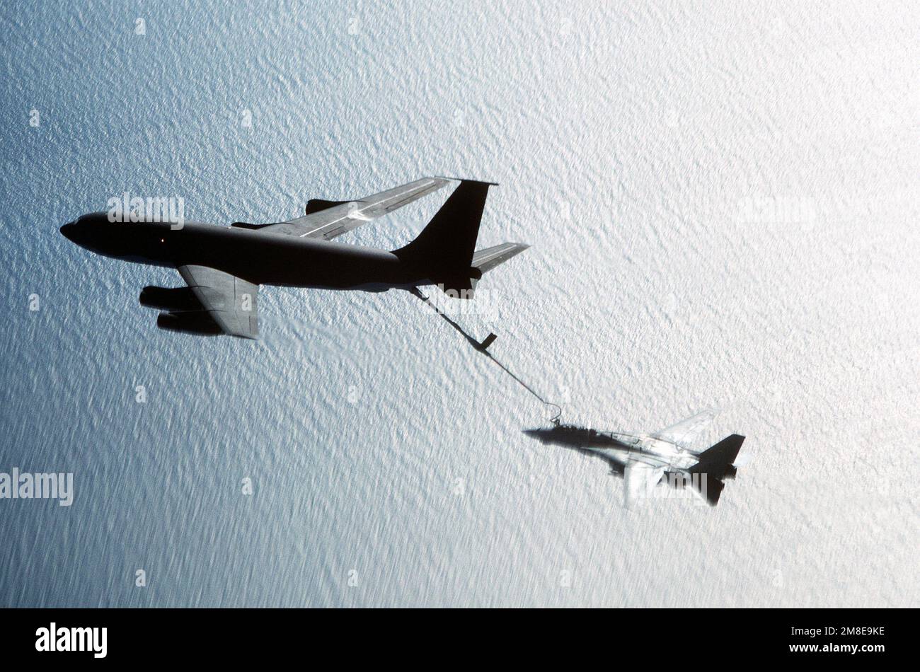 A Fighter Squadron 32 (VF-32) F-14A Tomcat aircraft is refueled by a U ...